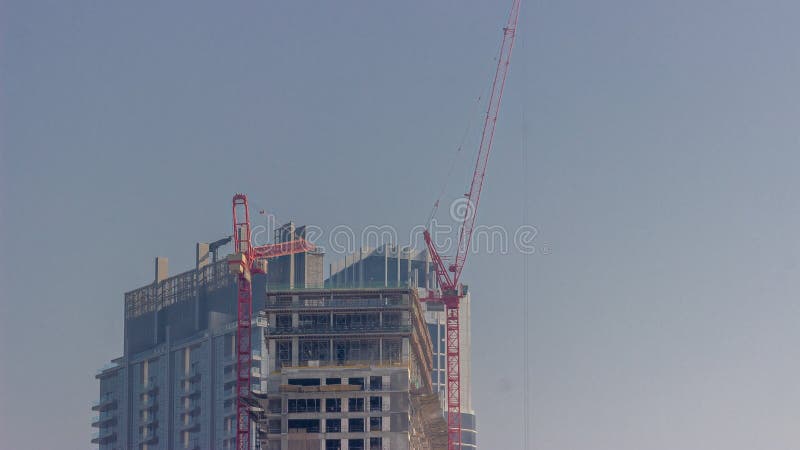 Two Cranes Working on Constraction Site Works of New Skyscraper ...