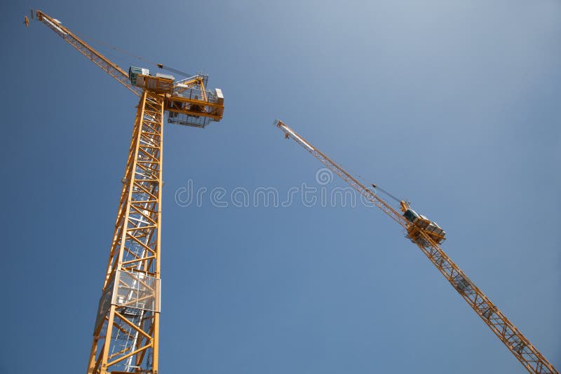 Two Cranes Working in Tandem on a Construction Site in the UK Editorial ...
