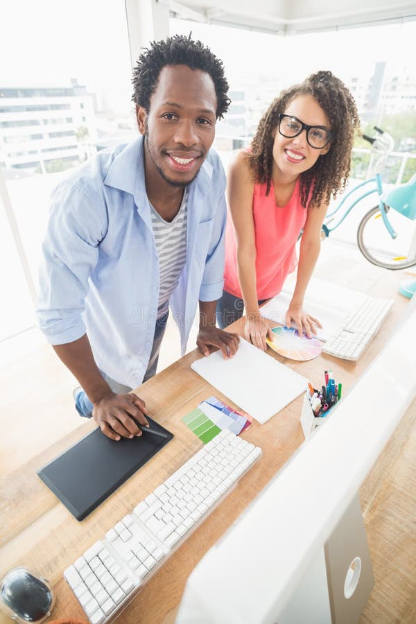 Two Creative Business Colleagues Looking at the Camera Stock Photo ... Two Creative Business Colleagues Looking at the Camera Stock Photo ...