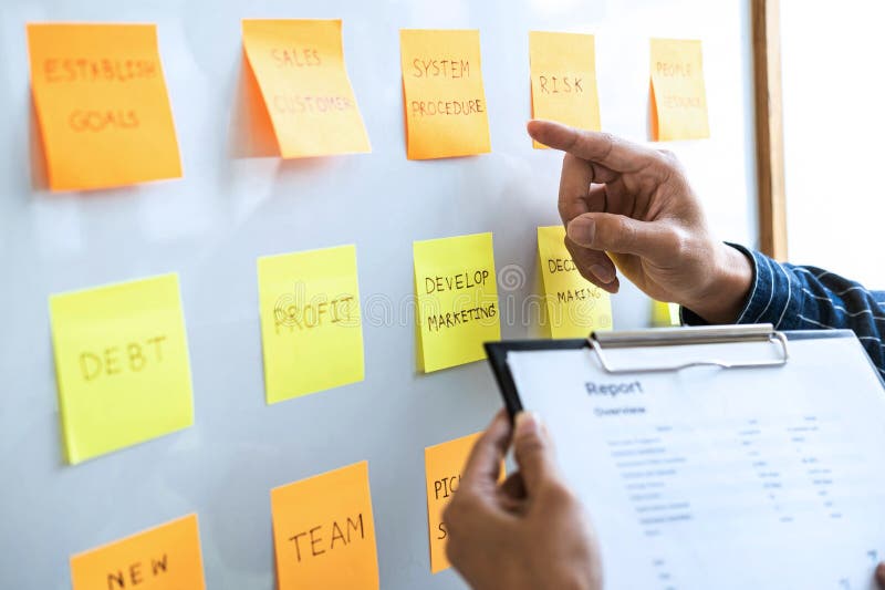 Two Creative Business People Meeting and Planning Use Post it Notes on ...