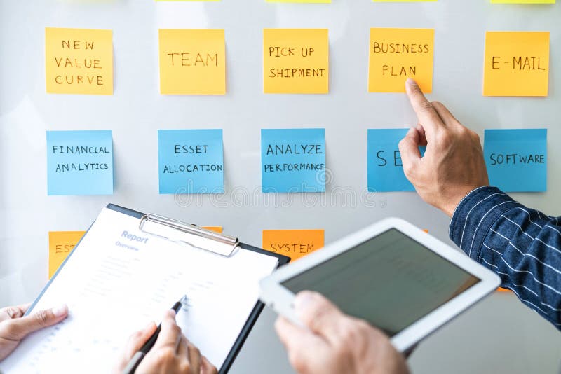 Two Creative Business People Meeting and Planning Use Post it Notes ...