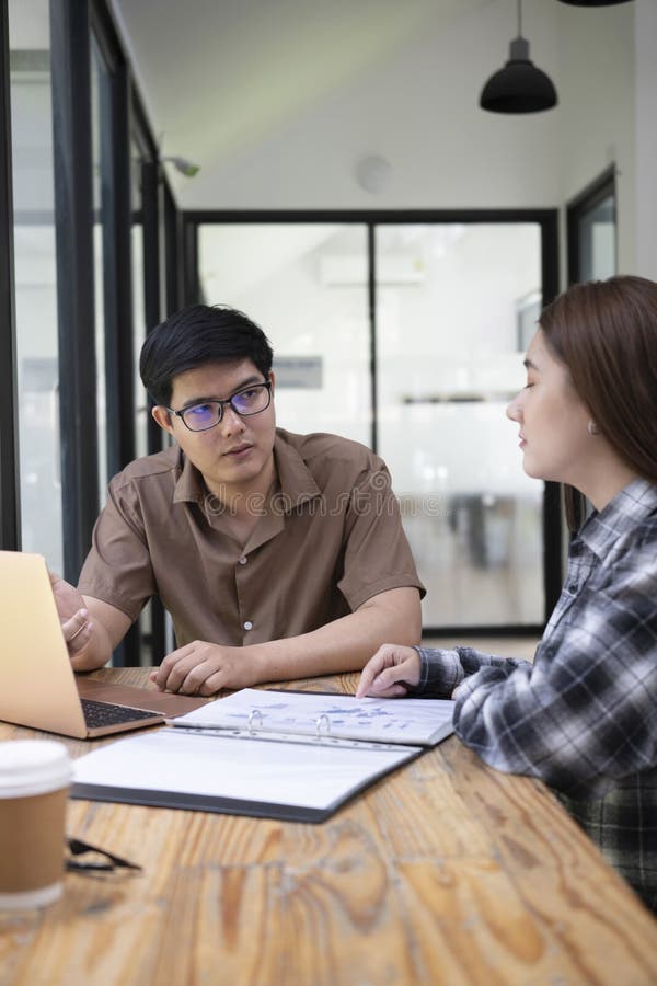 Two Creative Designer Working Together in the Modern Workplace. Stock ...