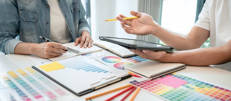 Two Creative Graphic Designer Working on Color Selection and Drawing on ...