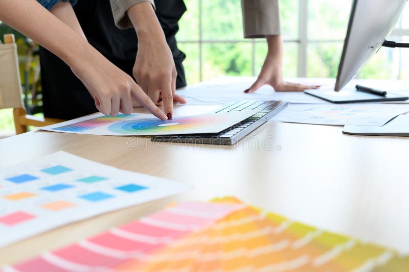 Two Creative Graphic Designer Working with Color Swatch Samples Chart ...