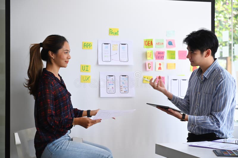 Two Creative People Planning Application and Developing Template Layout ...