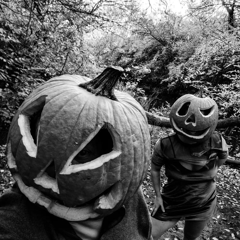 Creepy Pumpkin Heads in the Forest, Grayscale Shot Stock Image - Image ...