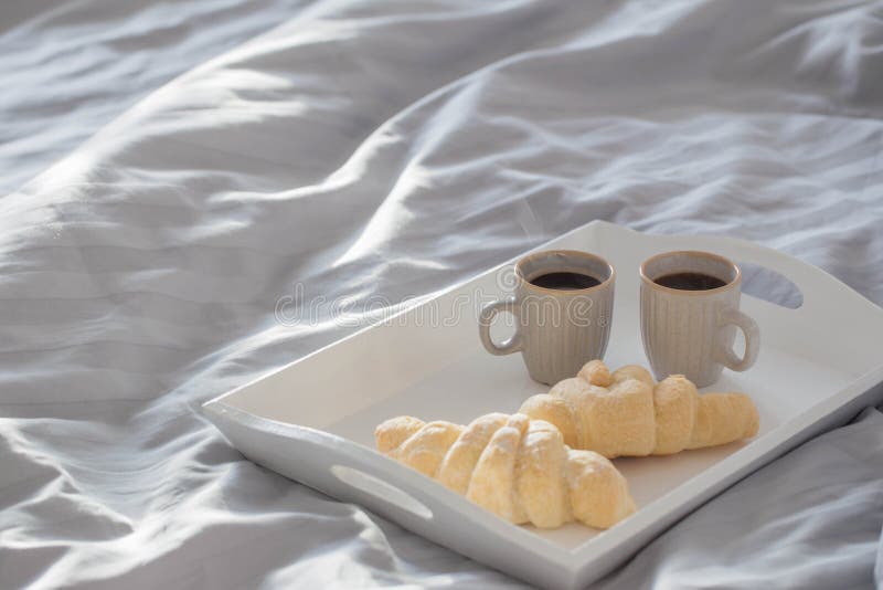 Croissants and Two Cups of Coffee on Bed Stock Photo - Image of ...