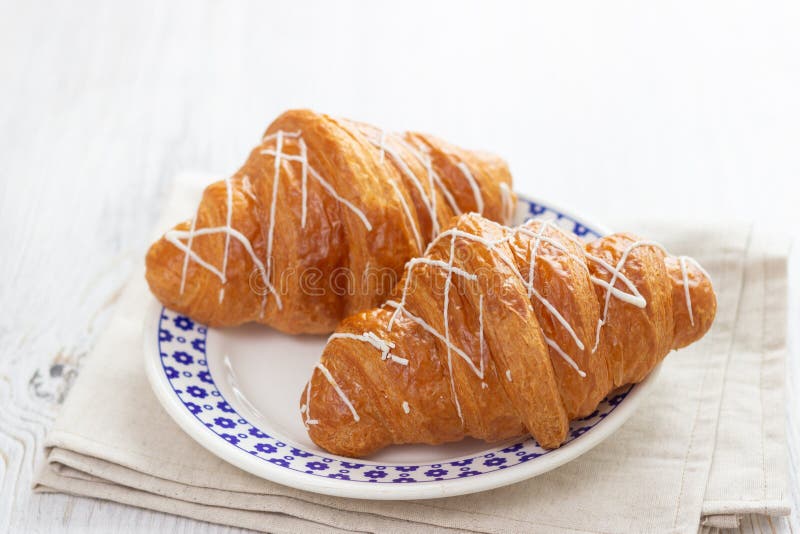 Two croissants on a plate stock photo. Image of french - 141171178