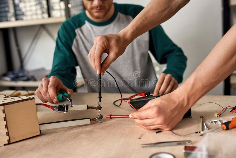 Two Cropped Technicians or Engineers Do Experiment Stock Photo - Image ...