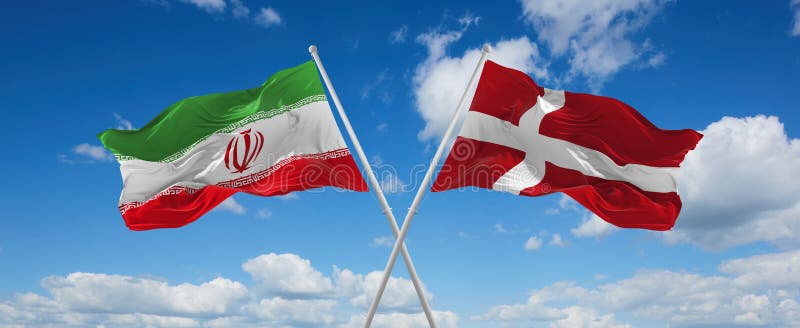 Two Crossed Flags Denmark and Iran Waving in Wind at Cloudy Sky ...