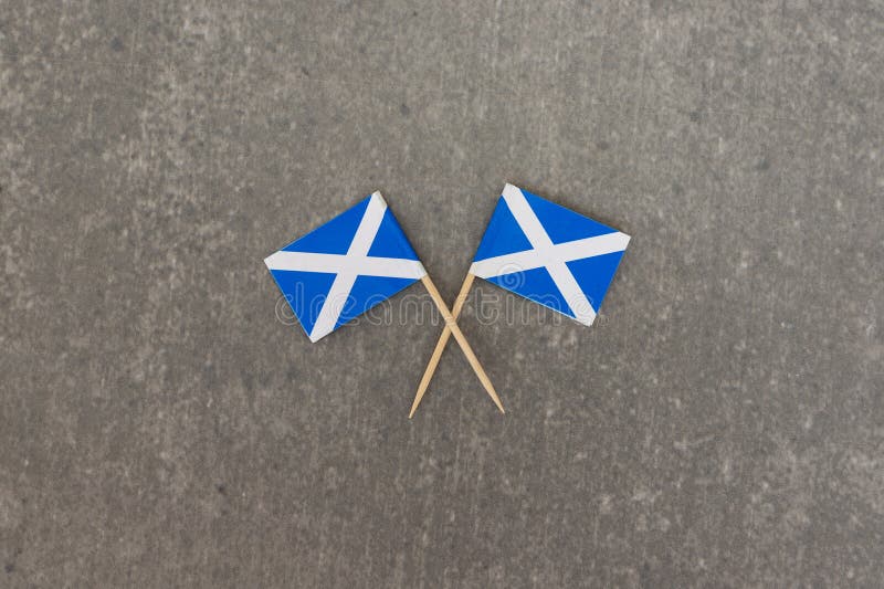 Two Crossed Scottish Flags on Grey Rough Textured Background Stock ...