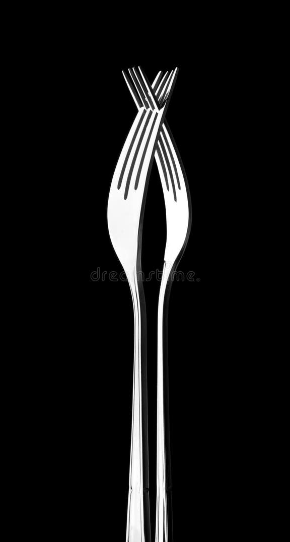 Two crossed silver forks stock photo. Image of crossed - 24673212
