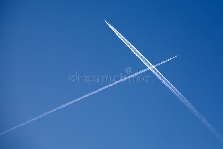 Two crossing plane traces stock photo. Image of speed - 7994190