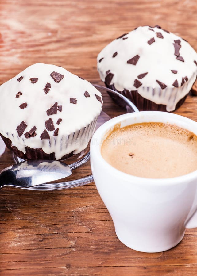 Two Cupcakes with a Cup of Coffee Stock Photo - Image of pastry ...