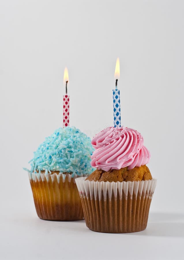 Two Cupcakes With Lit Candles Royalty Free Stock Image - Image: 12931266