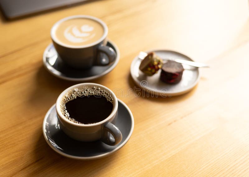 Two Cups of Coffee and Cakes on the Table Stock Photo - Image of ...