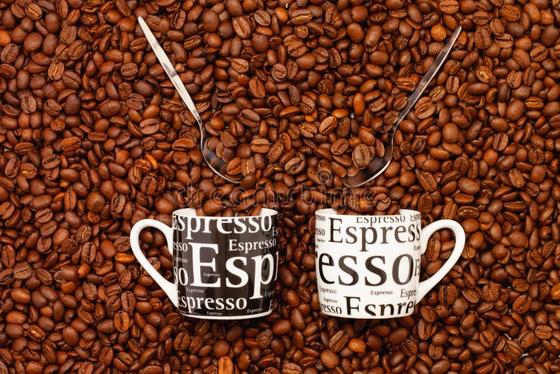 Two Cups of Coffee on a Table Full of Coffee Beans Stock Image - Image ...