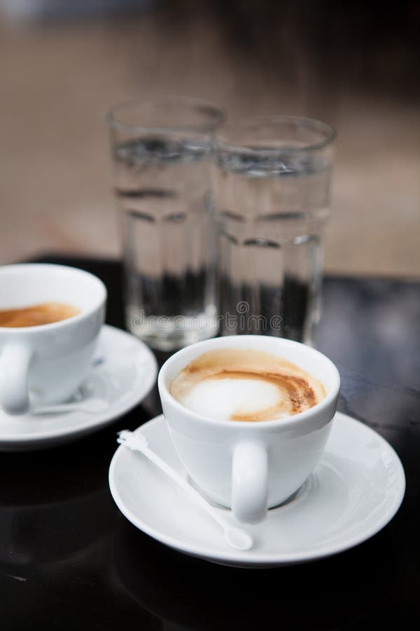 Two Cups of Coffee and Water Stock Photo - Image of milk, cappuccino ...