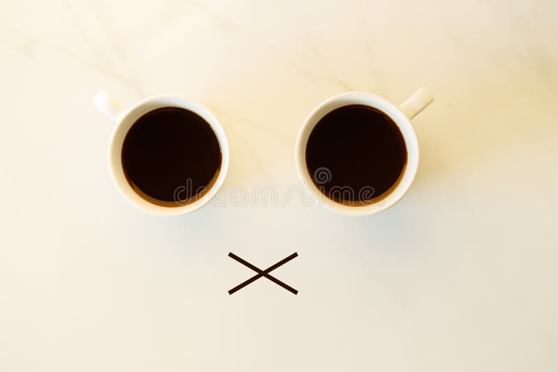 Two Cups of Coffees Arranged As Human Face with Line Showing Emotion ...