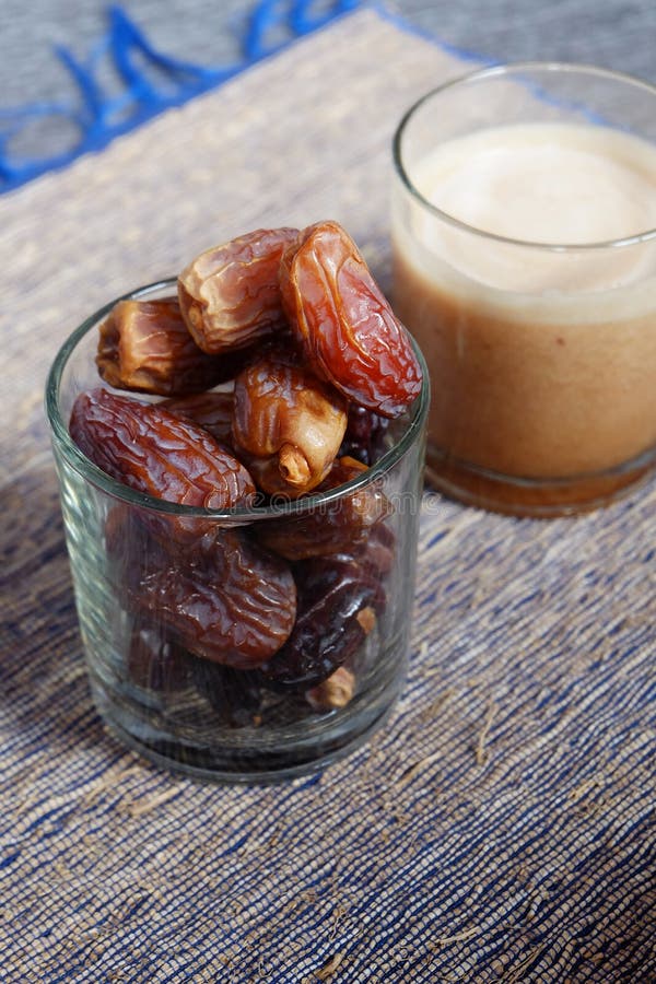 Two Cups Each Filled by Dates Fruit and Dates Juice Stock Photo - Image ...