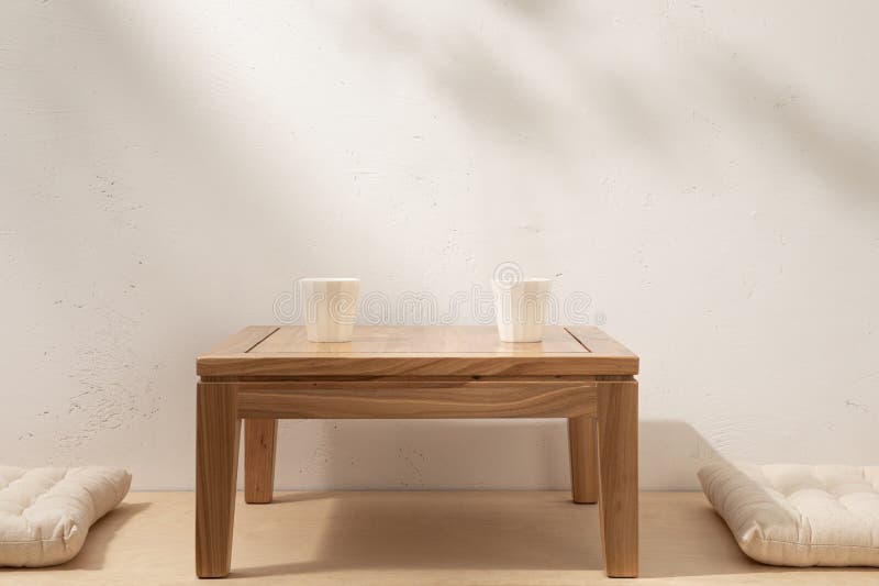 Two Cups are on the Square Table Under the Sunlight and Tree Shadow ...