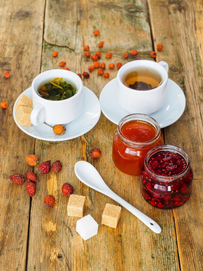 Two Cups of Tea and Jam on a Wooden Table. Tea in a Cozy Atmosphere ...