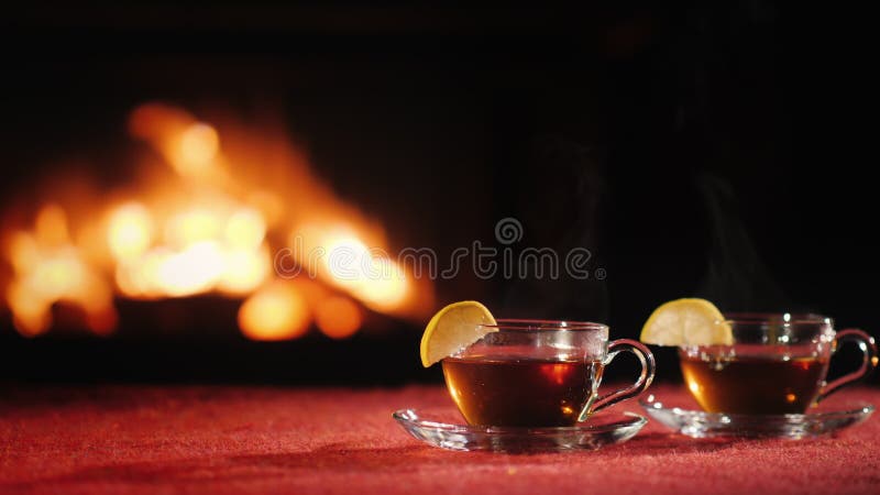 Two Cups with Tea Stand on a Table on a Black Background Where You Can ...
