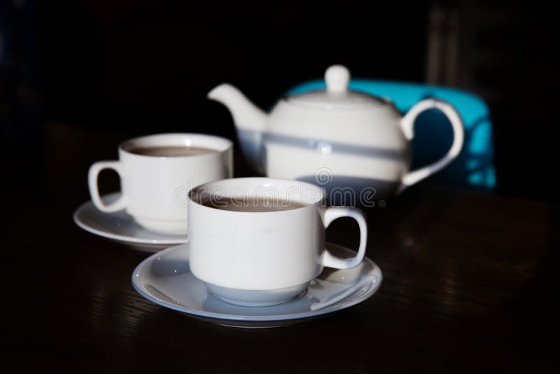 Two Cups of Tea and Teapot on the Table Stock Image - Image of natural ...