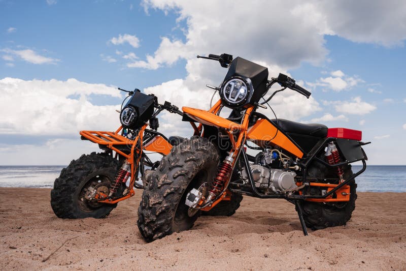 Two Custom Off-road Sports Motorcycles are Parked on Beach Outdoors ...