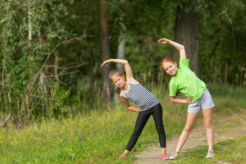 Two Cute Girls Doing Exercises Workout Stock Photo - Image of caucasian ...