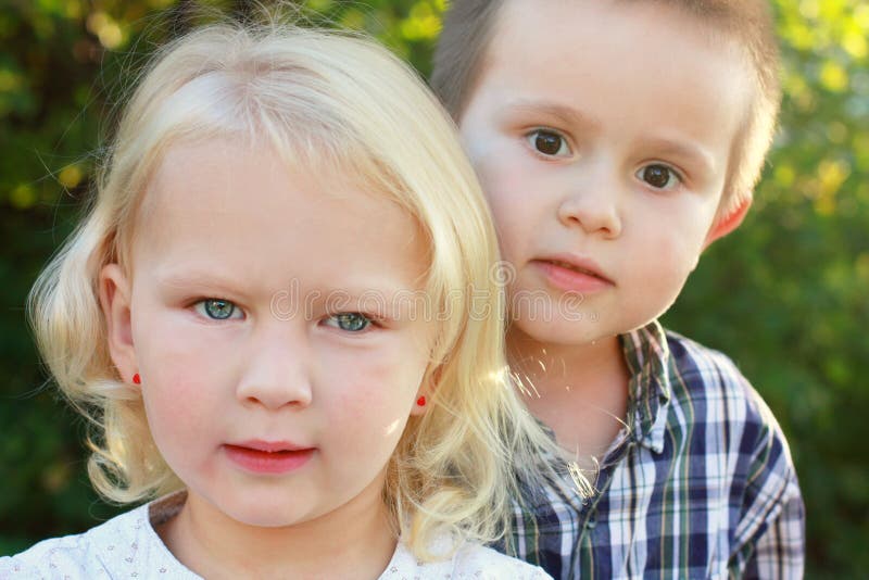 Two cute kids stock photo. Image of cute, summer, suspicious - 67238290