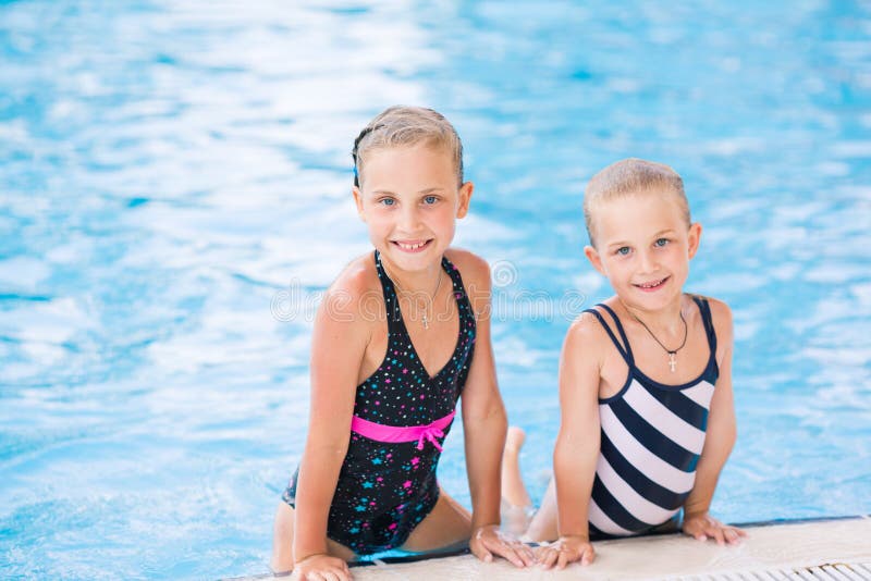 Two Cute Little Girls in Swimming Pool Stock Image - Image of childhood ...