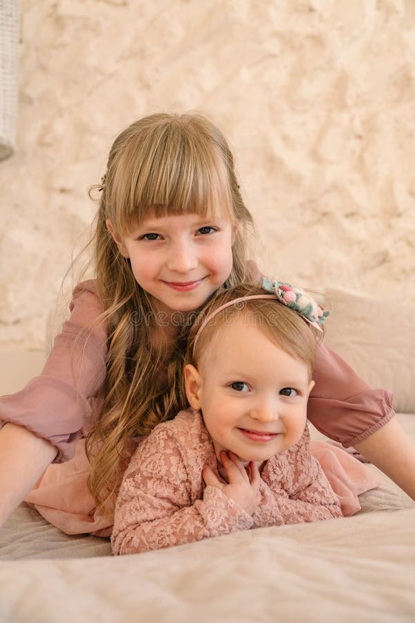 Two cute sisters portrait stock photo. Image of sister - 294064644