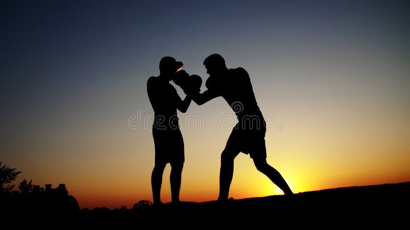 Two Dark Male Figures, at Sunrise, Against the Light, Boxing, Fighting ...