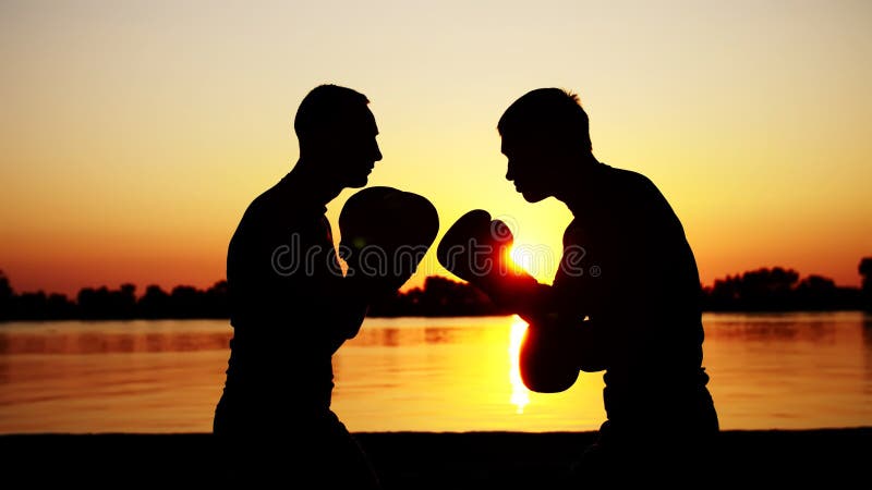Two Dark Male Figures, at Sunrise, Against the Light, Boxing, Fighting ...