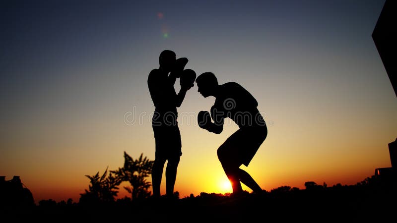 Two Dark Male Figures, at Sunrise, Against the Light, Boxing, Fighting ...