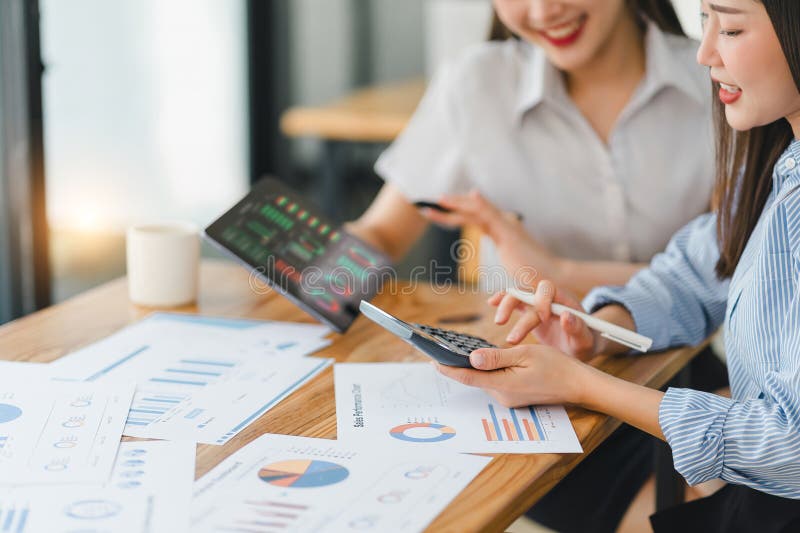Two Data Analysts Working On Data Analysis Dashboard For Business