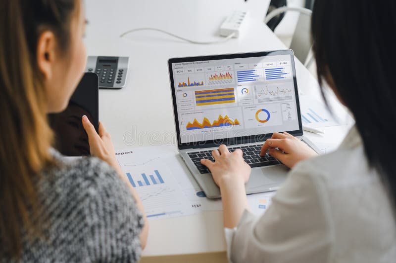 Two Data Analysts Working on Data Analysis Dashboard for Business ...