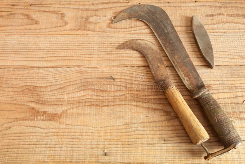 Two Dated and Used Billhooks on Wooden Background Stock Photo - Image ...