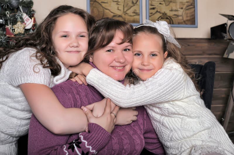 Two daughters with mother stock photo. Image of affection - 35411678