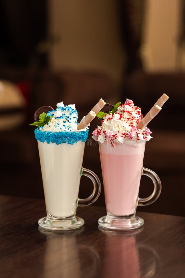 Two Decorated Milkshakes Pink and Blue on a Wooden Table Stock Photo ...