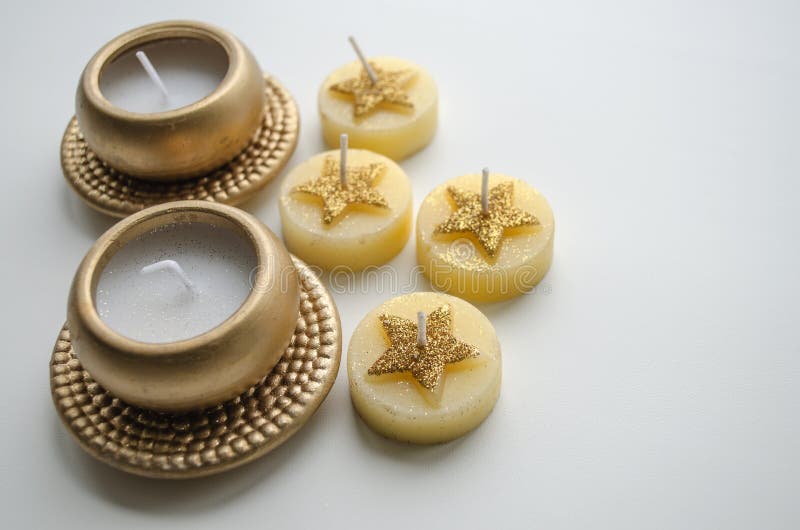 Two Decorative Candles in Gold Color and Four Candles with Star Pattern ...