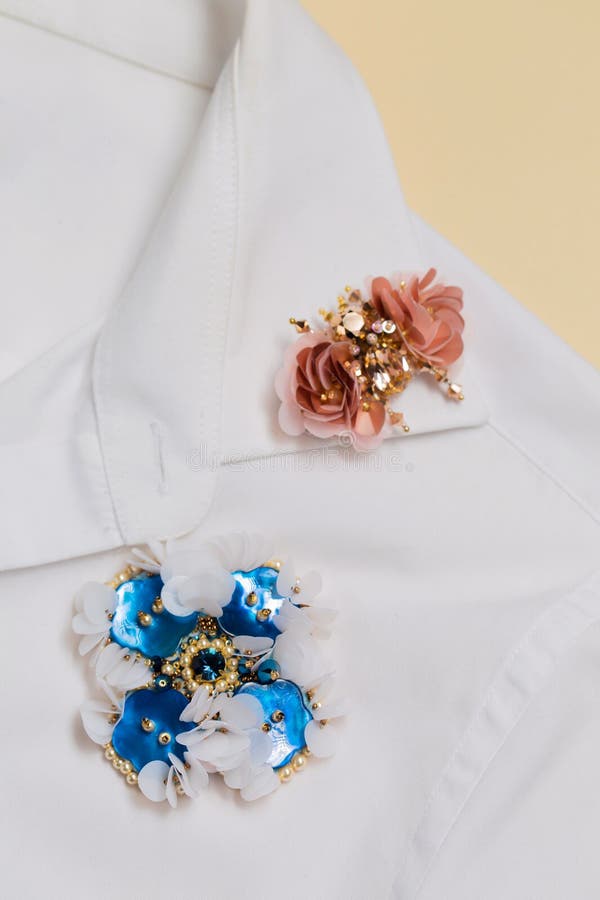 Two Decorative Handmade Brooches on the Collar Stock Image - Image of ...