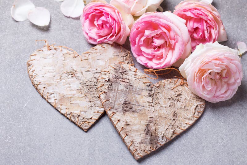 Two Decorative Hearts and Fresh Pink Roses on Grey Background. Stock ...