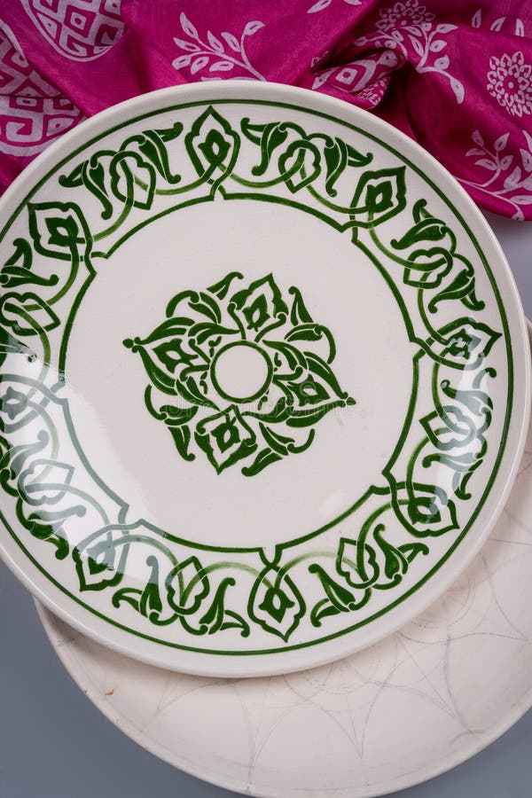Two Decorative, Painted White with Green Patterns Plate on a White ...