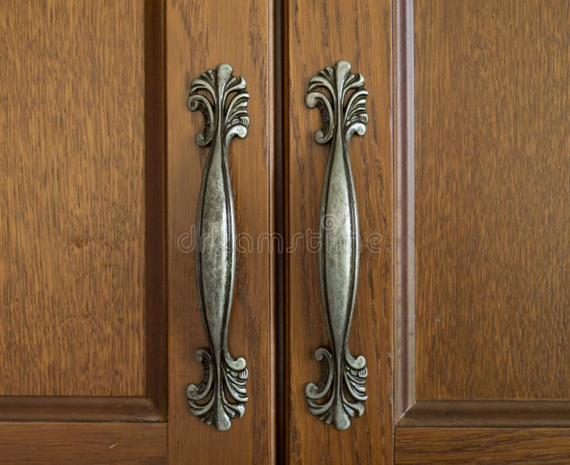 Two Decorative Verticalmetal Handles for Brown Cabinet Doors Close ...