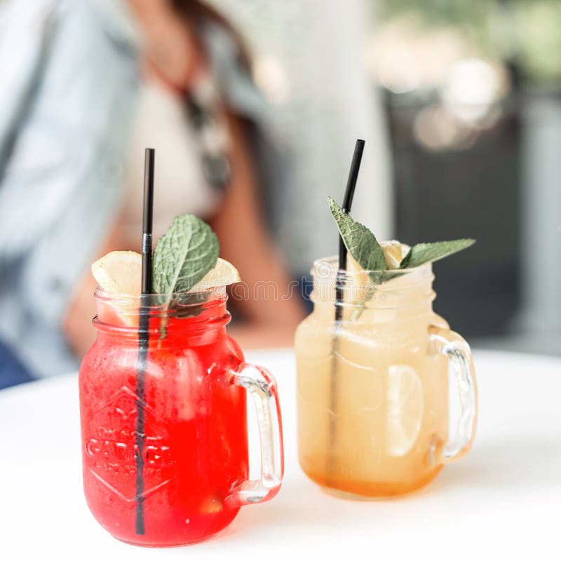 Two Delicious Fresh Drinks with Ice and Mint on a White Table. Summer ...