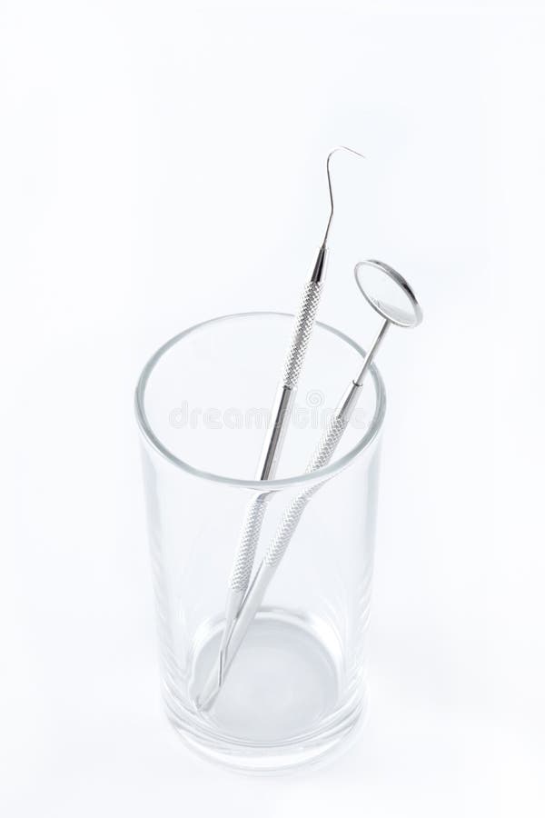 Two Dental Tools in the Glass : Dental Mirror and Probe Stock Image ...