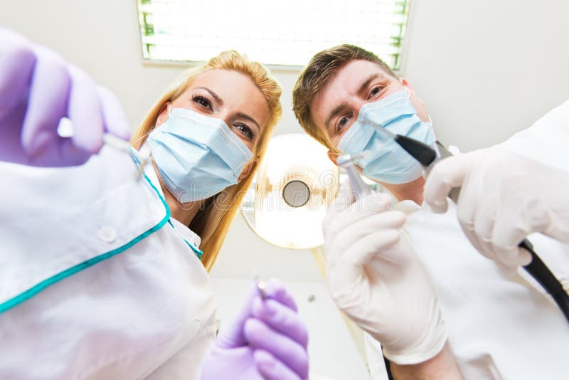 Two Dentists Examining Teeth Stock Photo - Image of expert, beautiful ...