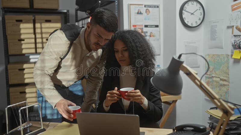 Two Detectives, a Man and Woman, Analyze Clues Over Coffee in an Office ...